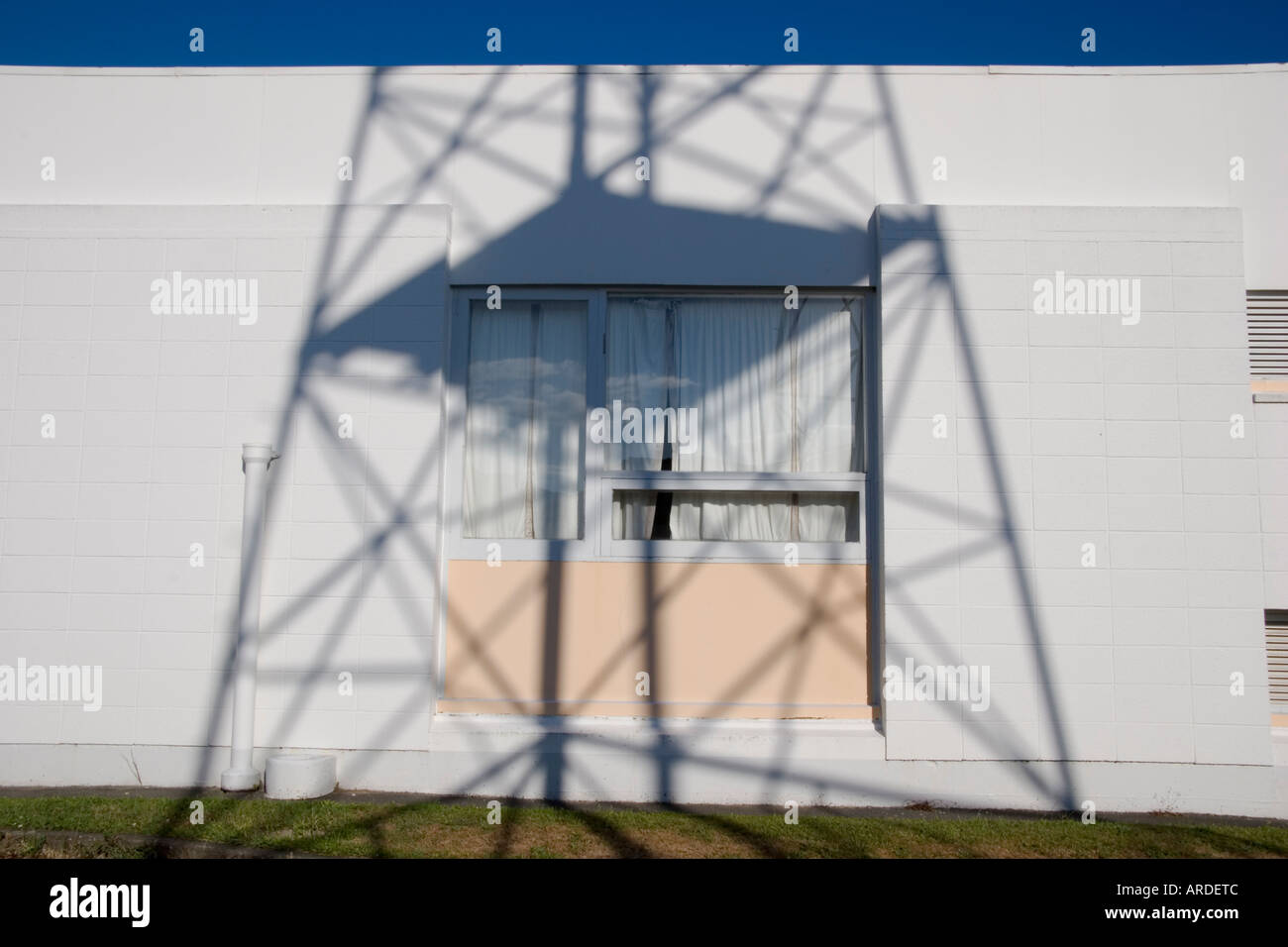 electrical tower shadow on building - 1 Stock Photo - Alamy