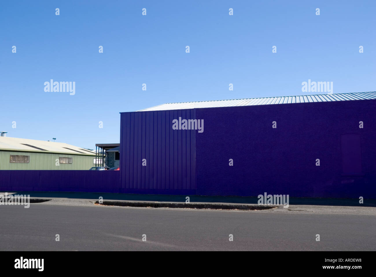 purple and green metal buildings Stock Photo - Alamy