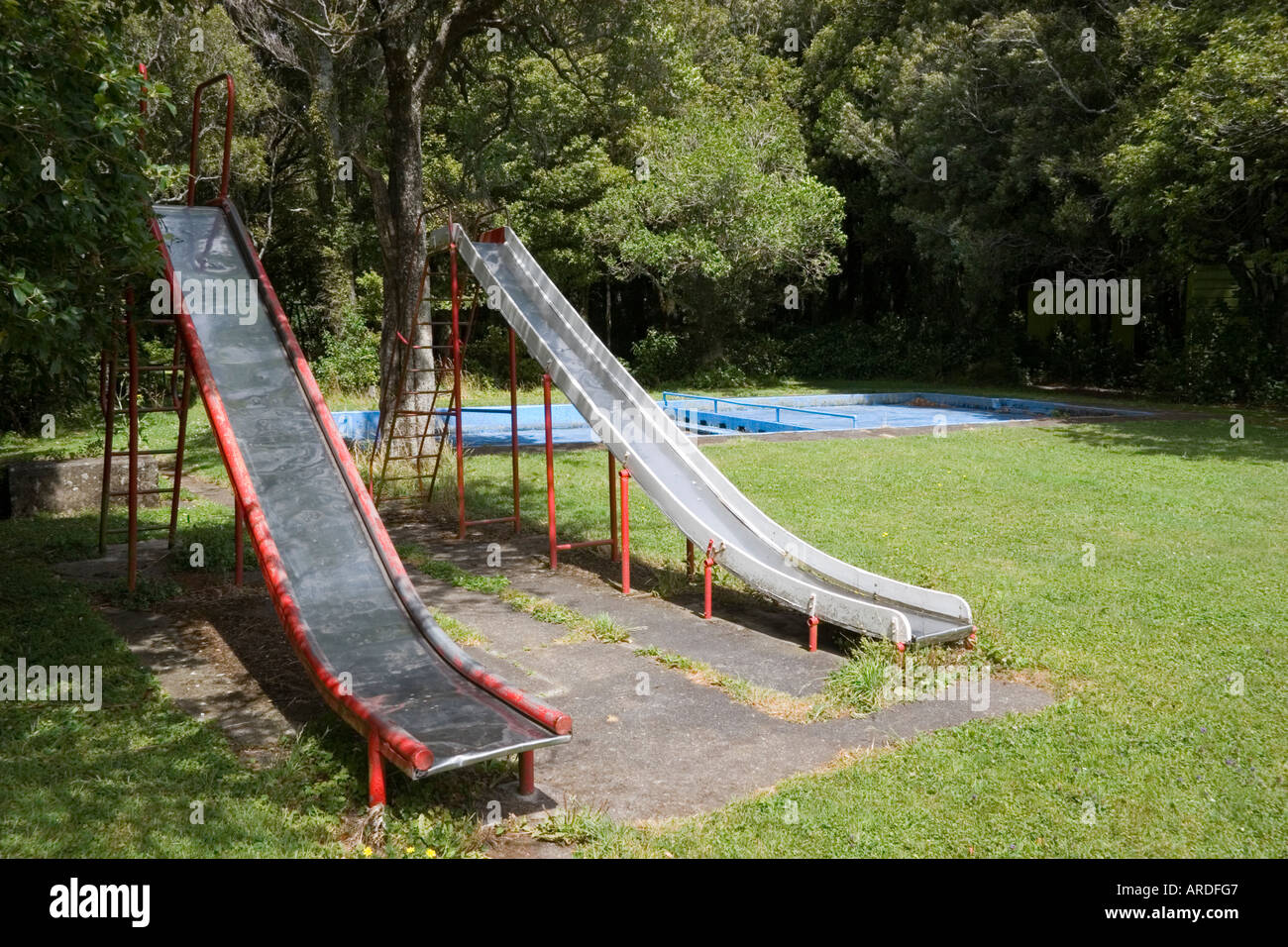 pair of sliding boards in small park Stock Photo - Alamy