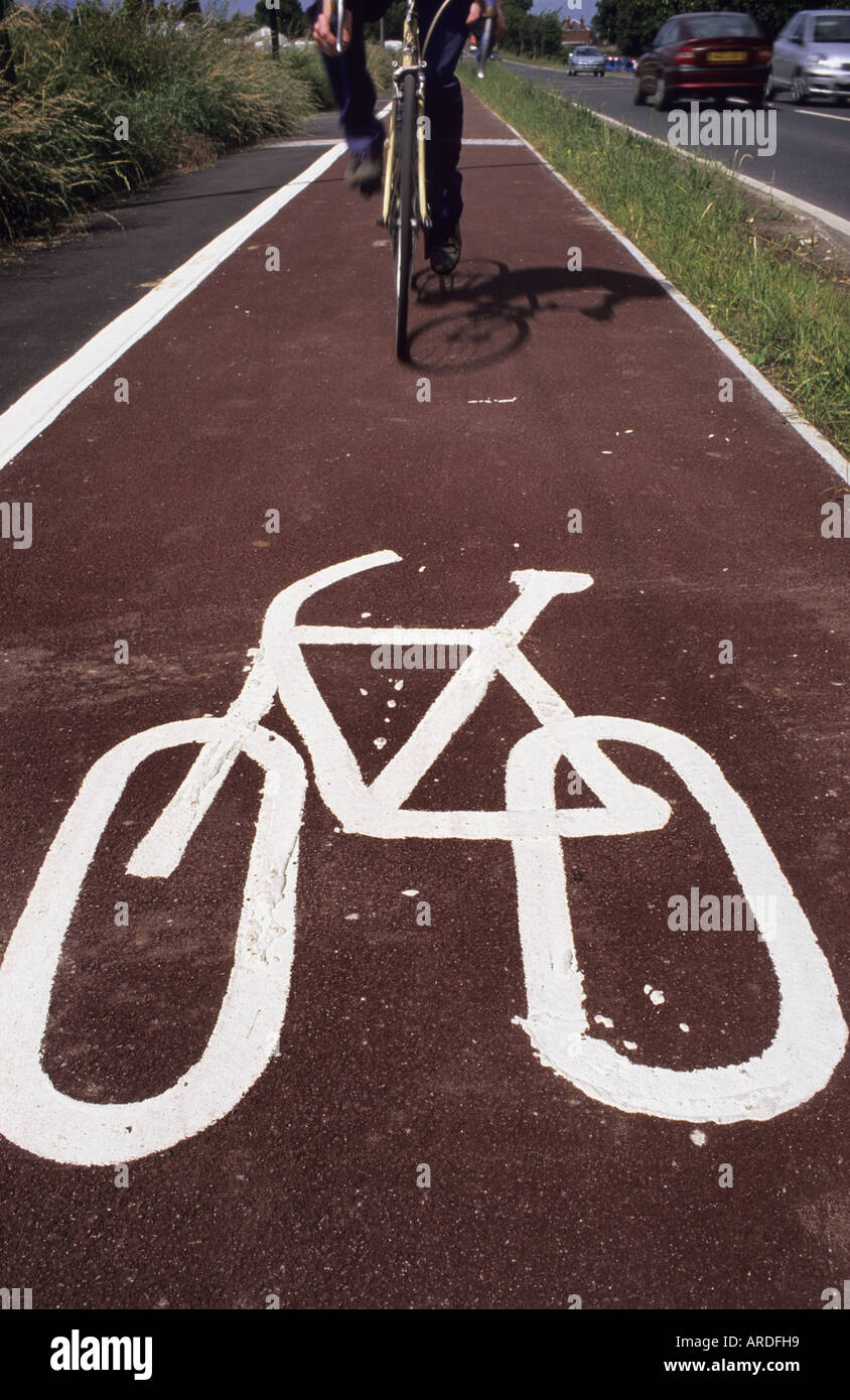 cyclist riding on cycle lane in the village of south milford leeds ...