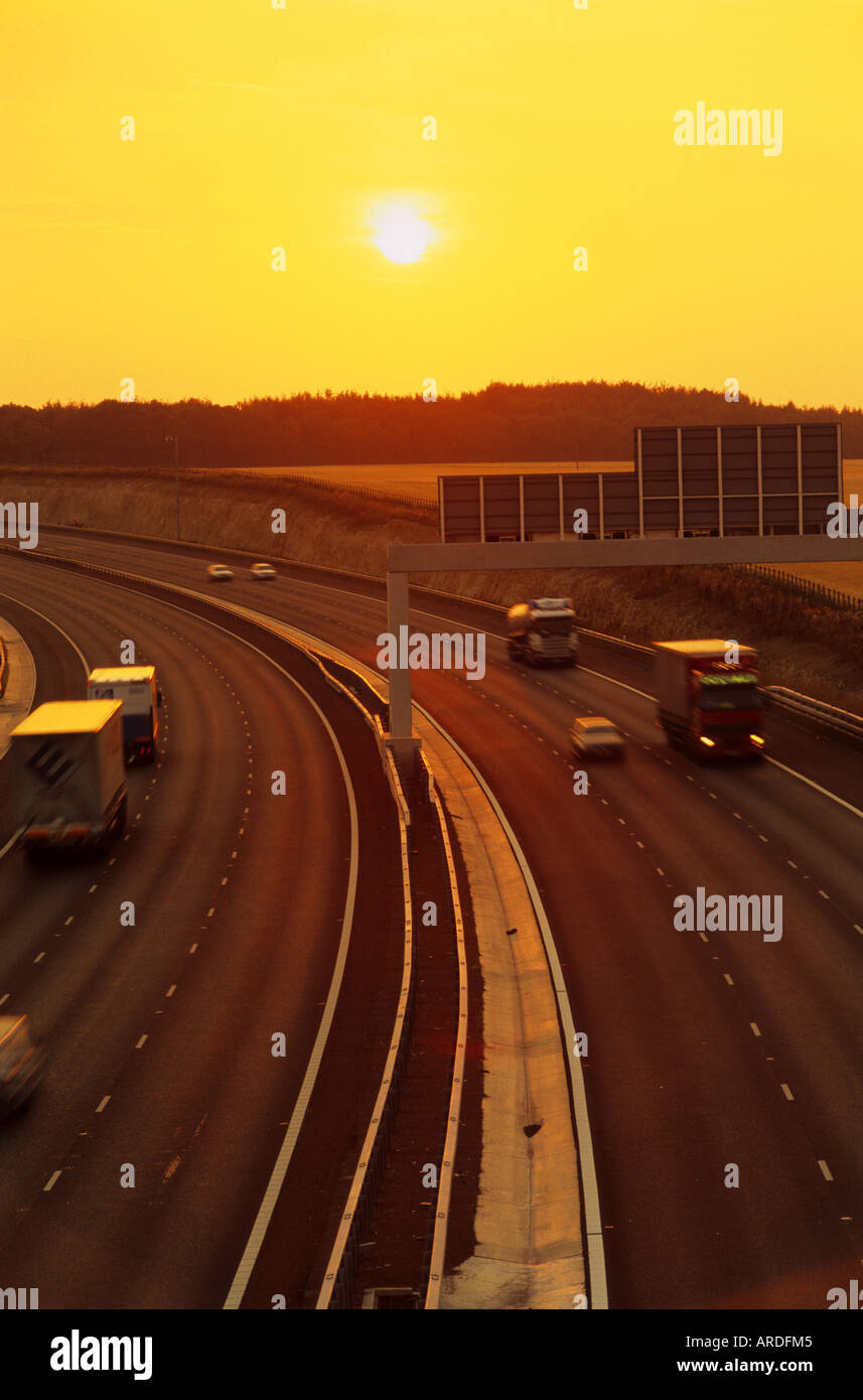 traffic travelling on the A1/M motorway at sunset leeds uk Stock Photo ...
