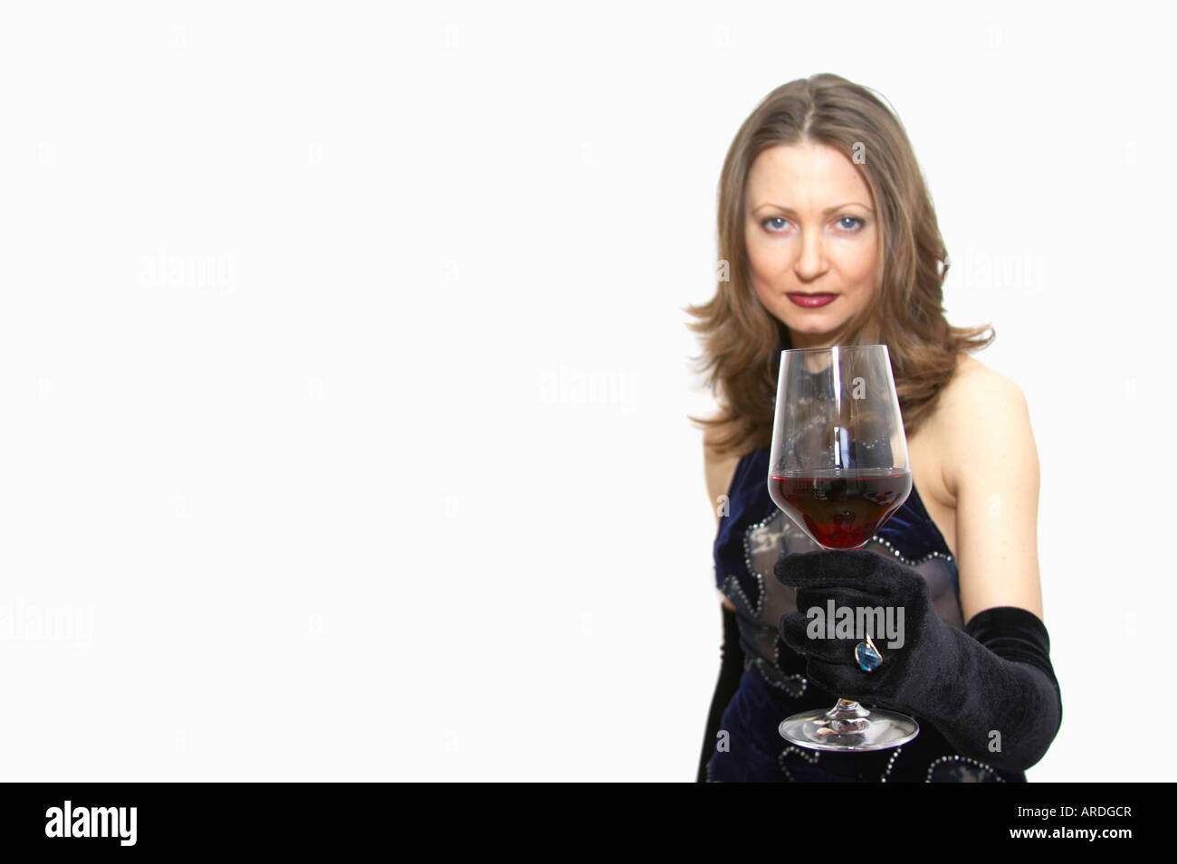 Female Holding Wine Glass Facing Camera Stock Photo - Alamy