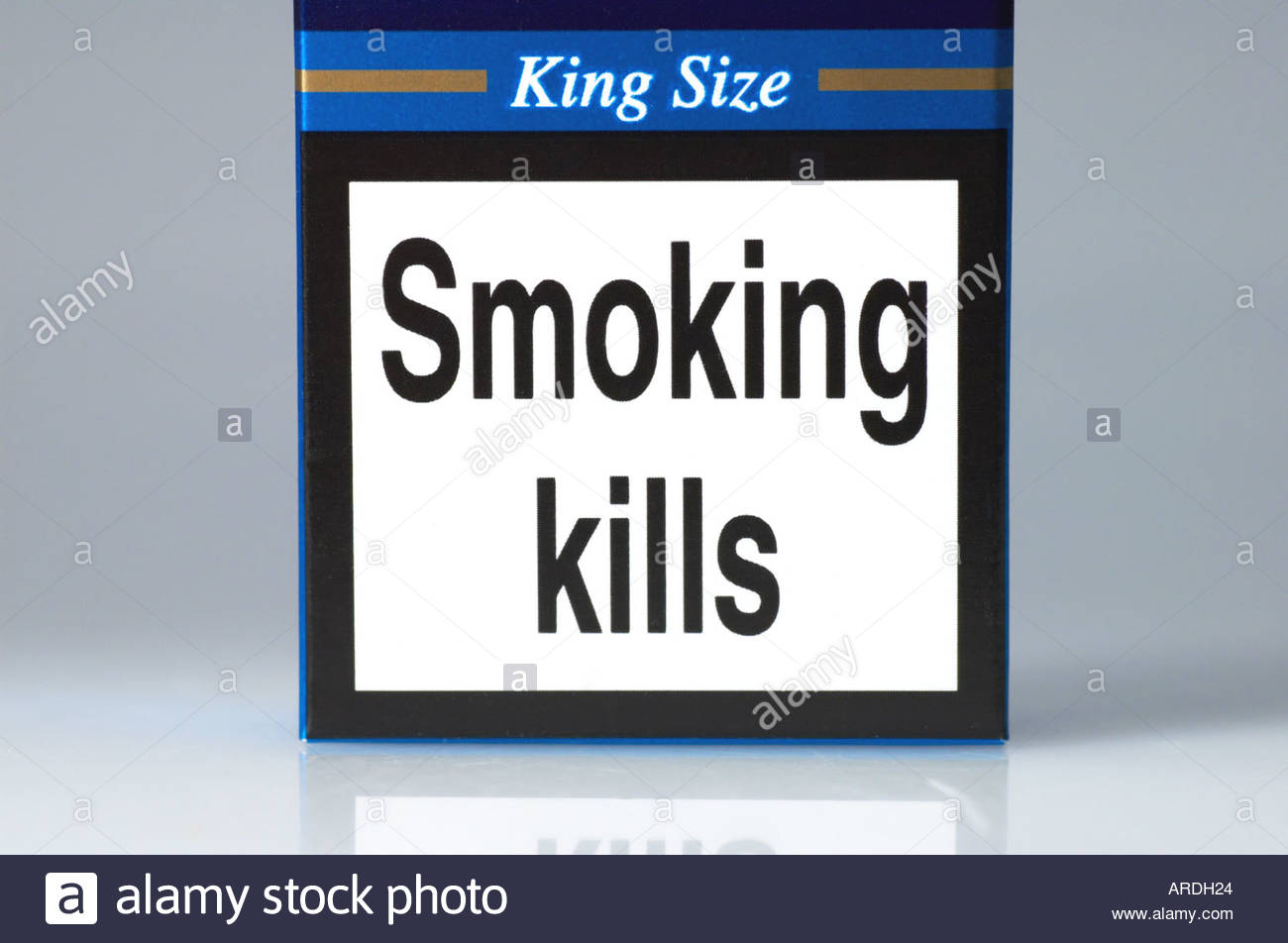 A cigarette packet and warning message Stock Photo - Alamy