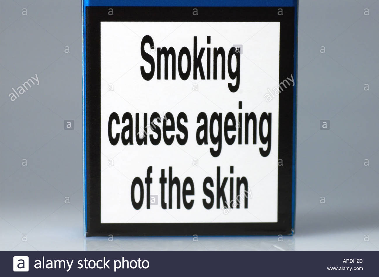 A cigarette packet and warning message Stock Photo - Alamy