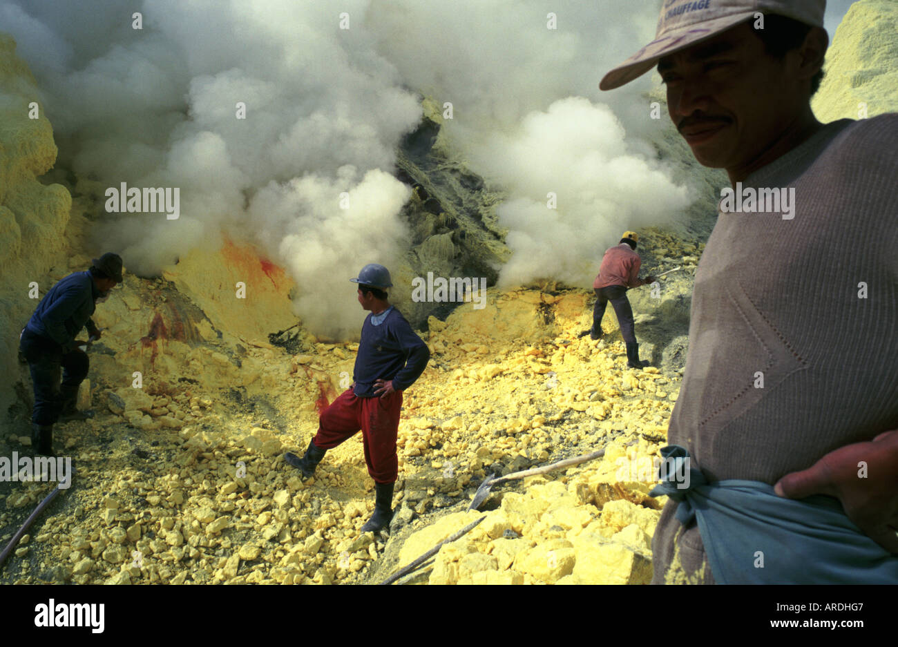Men working inside the live volcano of Kawah Ijen in East Java ...