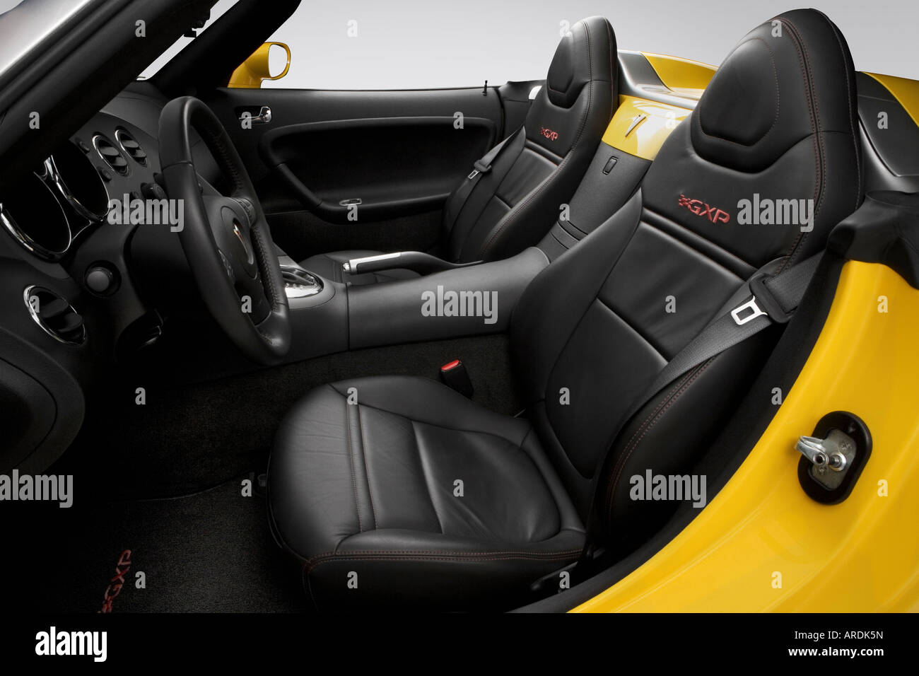 2007 Pontiac Solstice GXP in Yellow - Front seats Stock Photo - Alamy