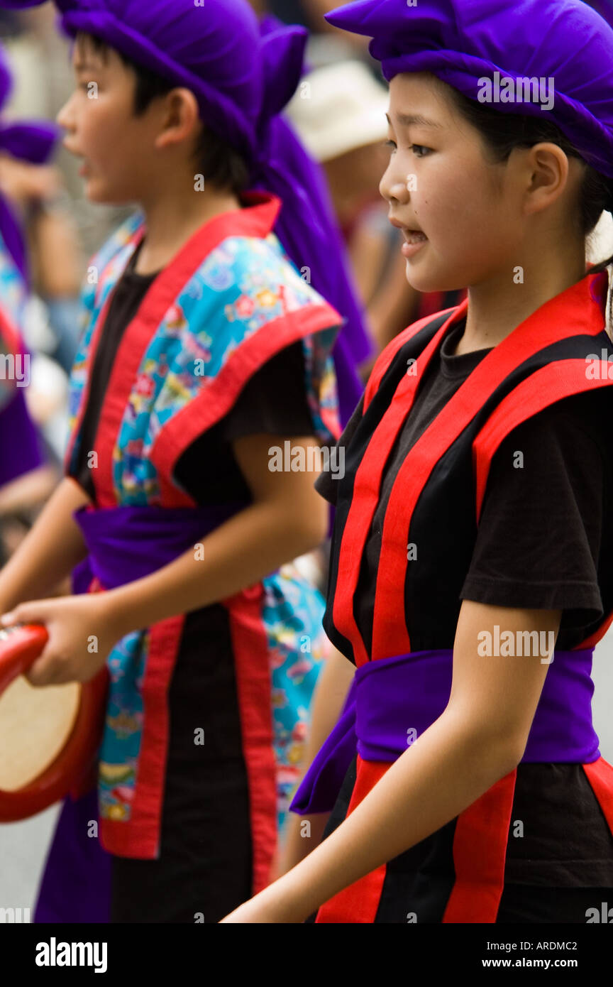 Children perform in a drumming and dancing summer festival in Shinjuku ...