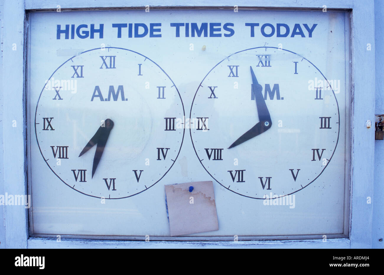 Glass case containing two clock faces with movable hands and labelled A ...