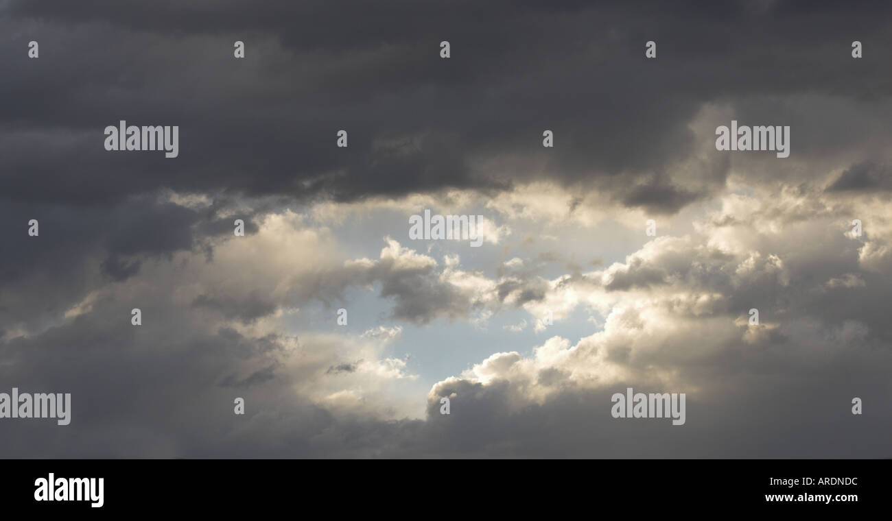 Sunset clouds gathering rain weather Stock Photo - Alamy
