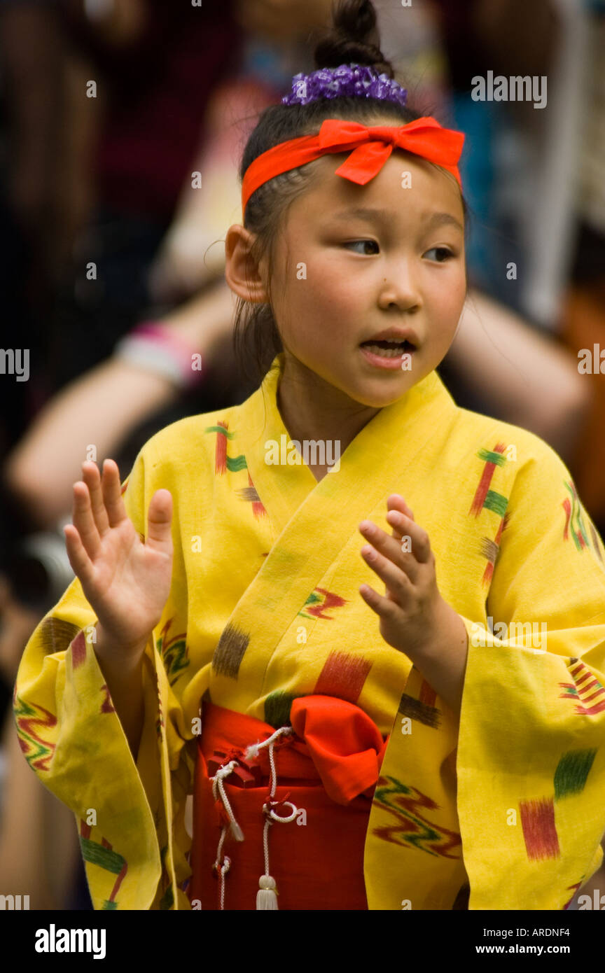 A child performs in a drumming and dancing summer festival in Shinjuku ...