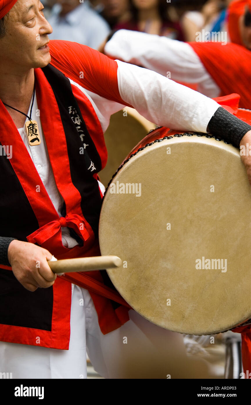 A drummer performs at a drumming and dancing summer festival in ...
