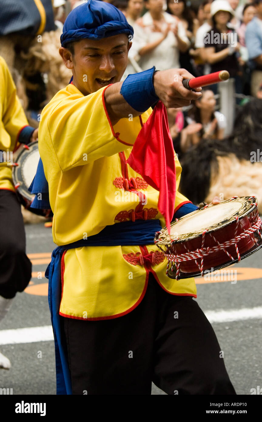 A drummer performs at a drumming and dancing summer festival in ...