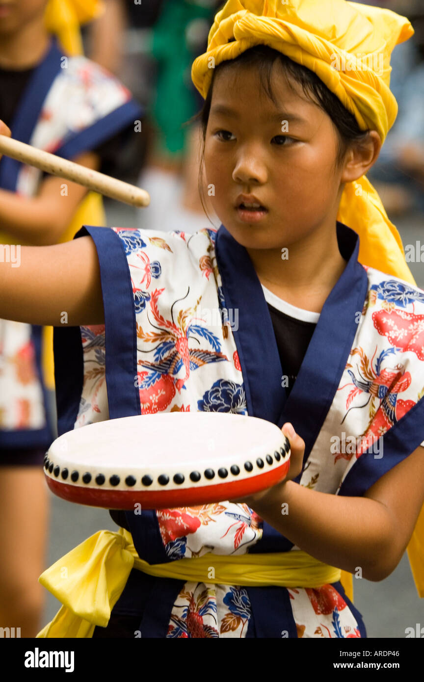A child performs in a drumming and dancing summer festival in Shinjuku ...