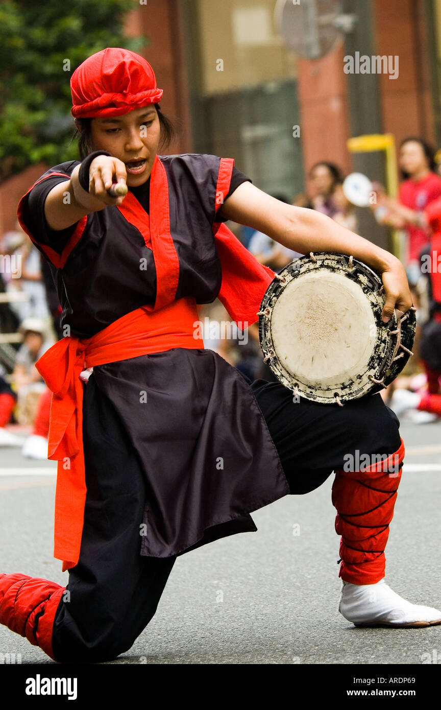 A drummer performs at a drumming and dancing summer festival in ...