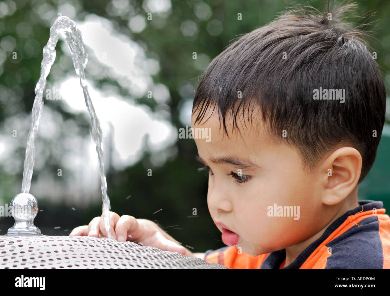 Child playing with water Stock Photo - Alamy