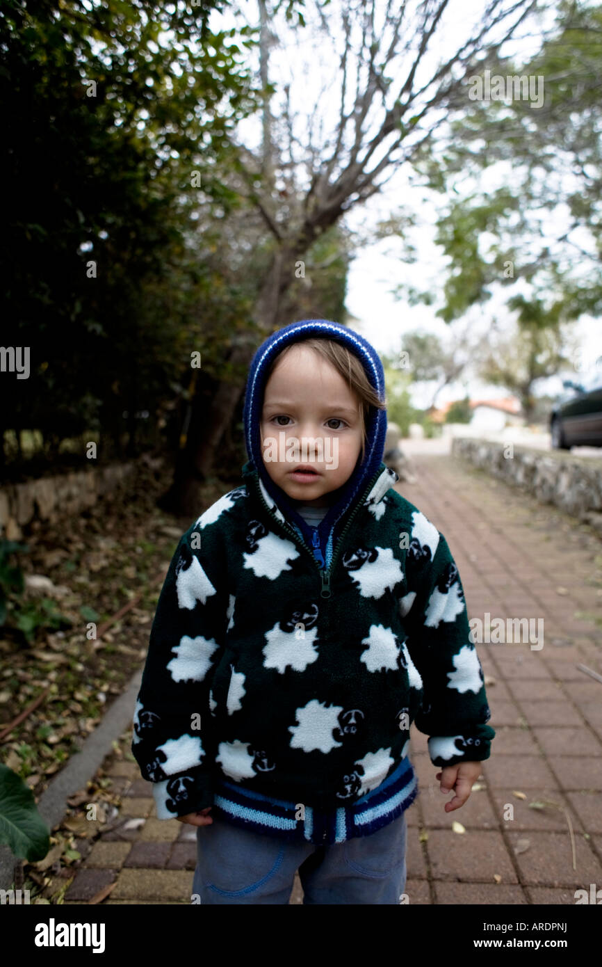a small kid staring at the camera Stock Photo - Alamy