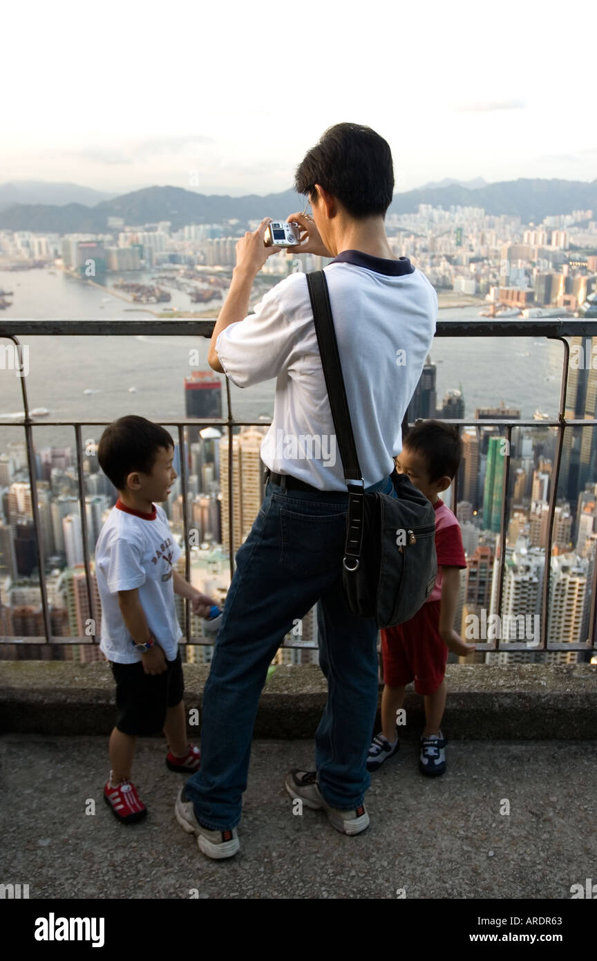 A father photographs Hong Kong Harbor Stock Photo - Alamy