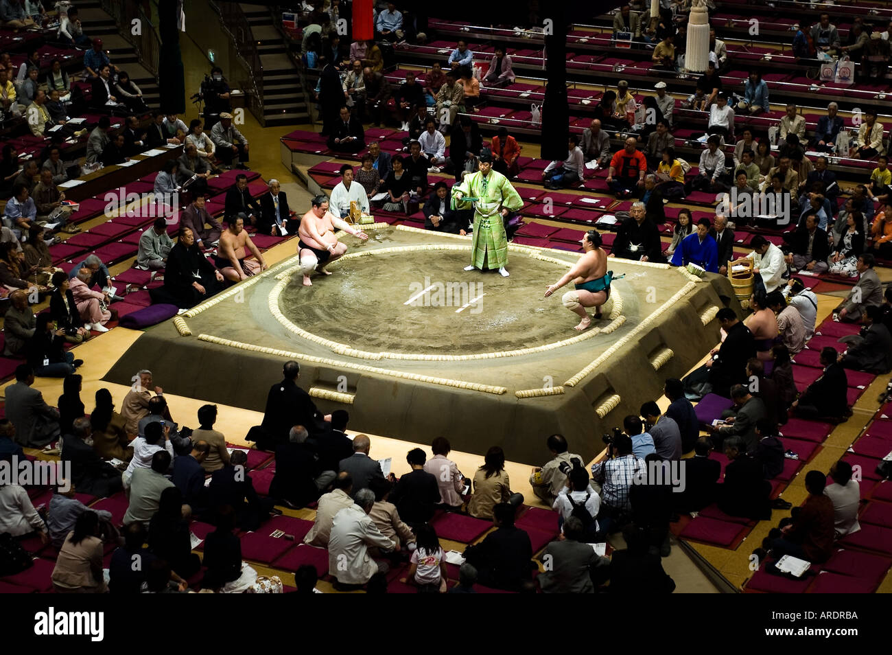 Sumo wrestlers prepare for their bout at the Ryogoku stadium in Tokyo ...