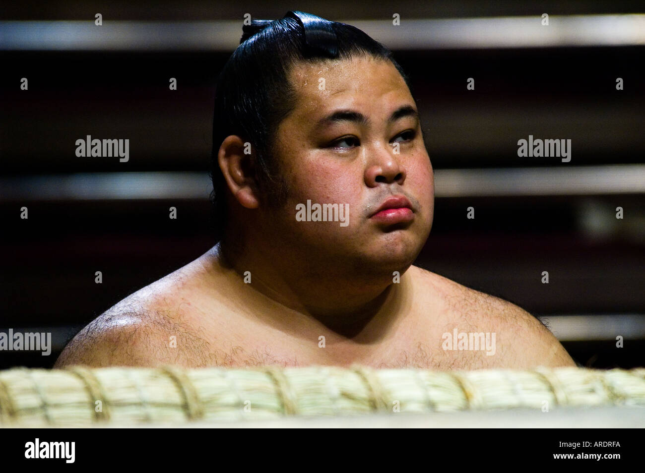A sumo wrestler prepares for his bout at the Ryogoku stadium in Tokyo ...