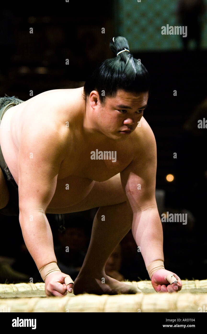 A sumo wrestler prepares for his bout at the Ryogoku stadium in Tokyo ...
