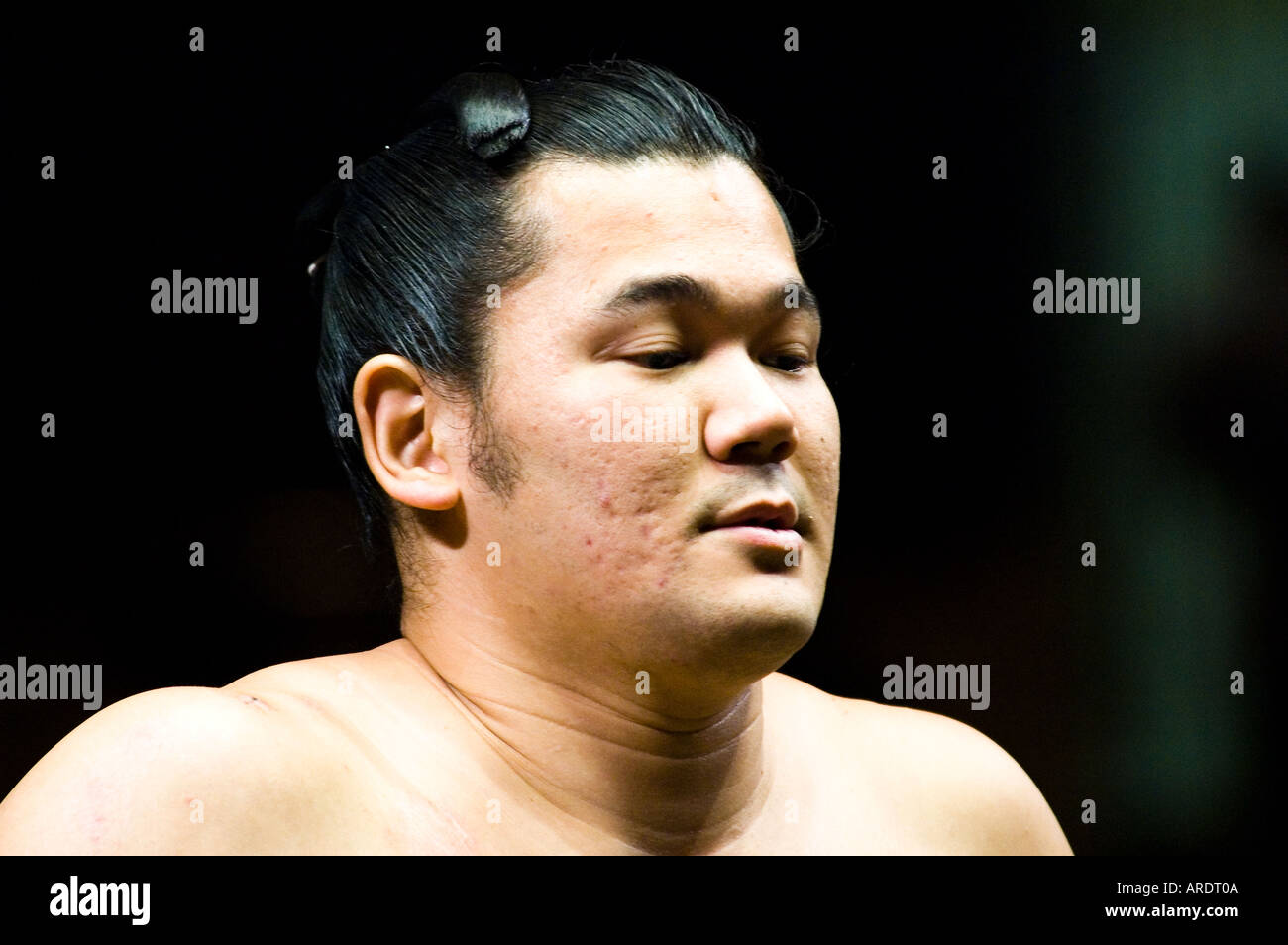 A sumo wrestler prepares for his bout at the Ryogoku stadium in Tokyo ...