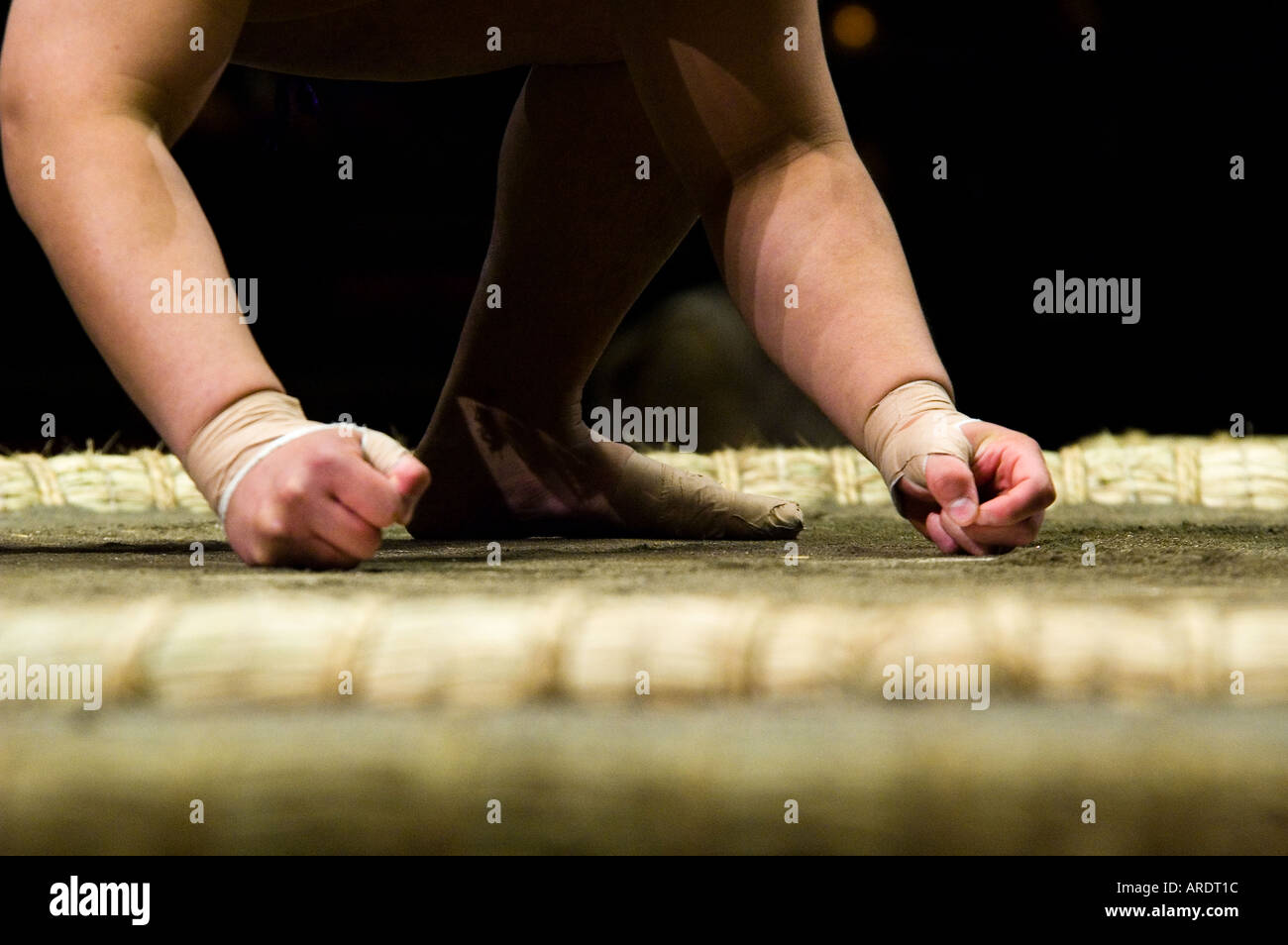 A sumo wrestler prepares for his bout at the Ryogoku stadium in Tokyo ...