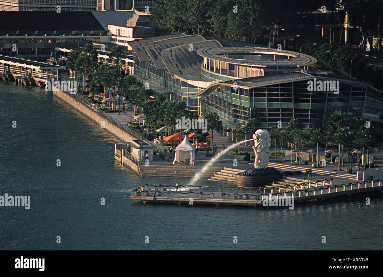 view of Singapore harbour and famous Merlion sculpture spouting water ...
