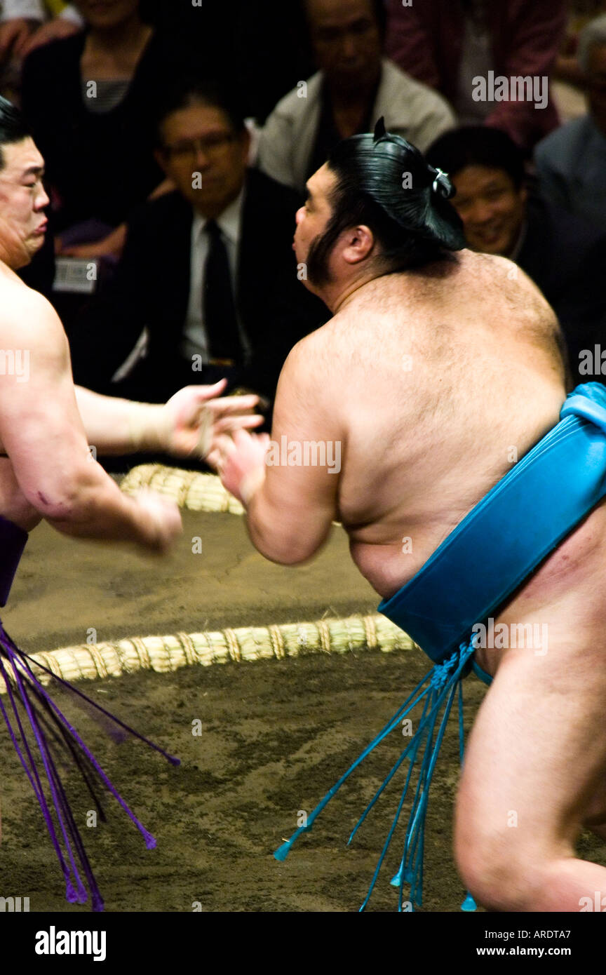 Sumo wrestlers grapple at the Ryogoku stadium in Tokyo Japan detail ...