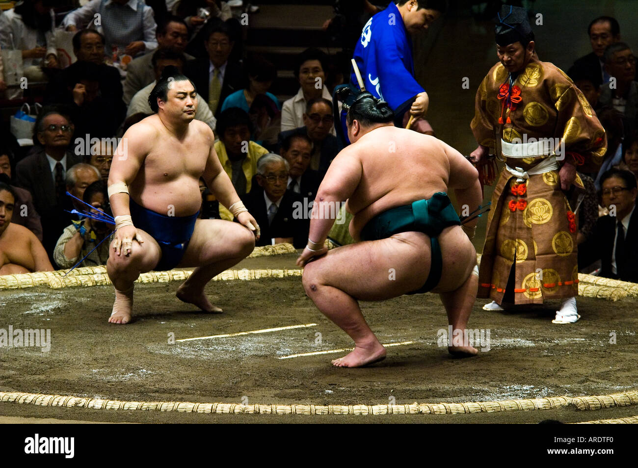 Sumo wrestlers prepare for their bout at the Ryogoku stadium in Tokyo ...