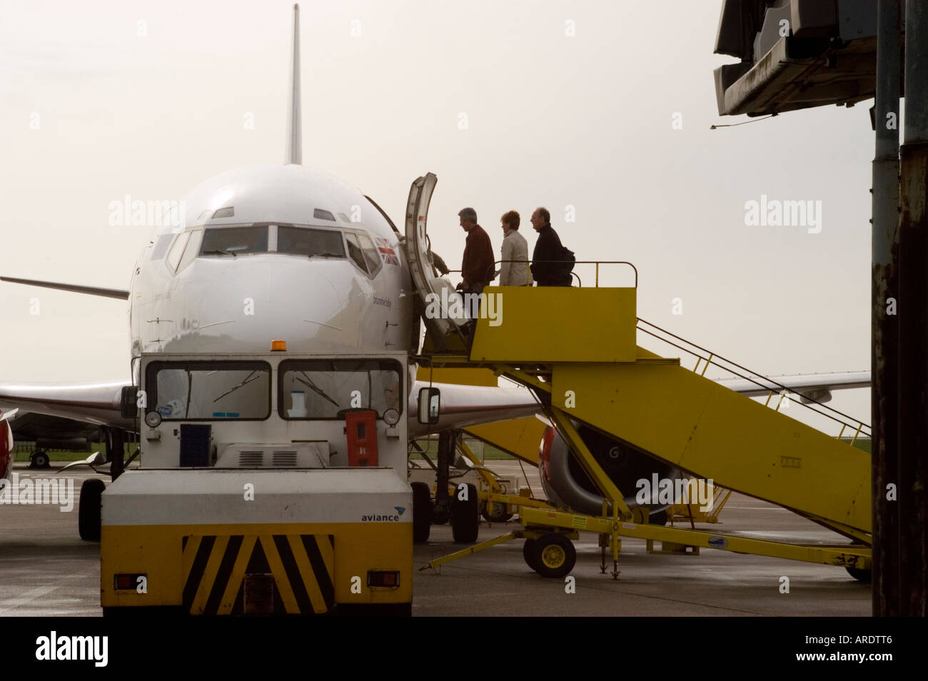 Passengers board short haul aircraft Stock Photo - Alamy