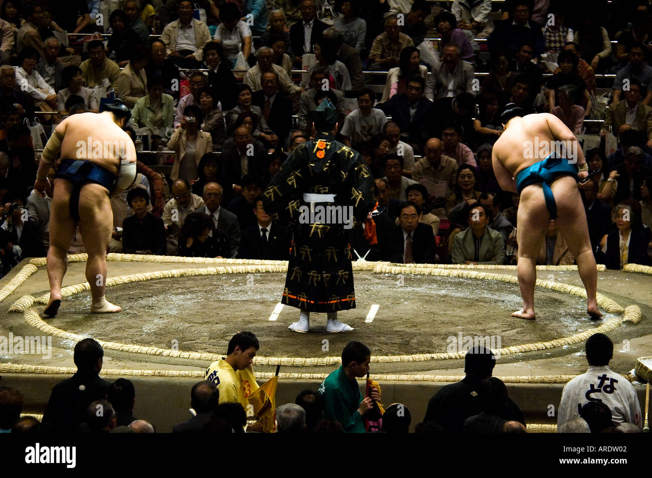 Sumo wrestlers prepare for their bout at the Ryogoku stadium in Tokyo ...