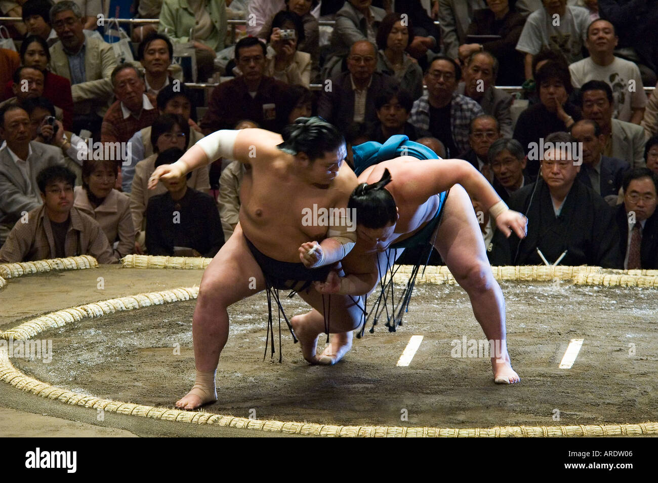 Sumo wrestlers grapple at the Ryogoku stadium in Tokyo Japan Stock ...