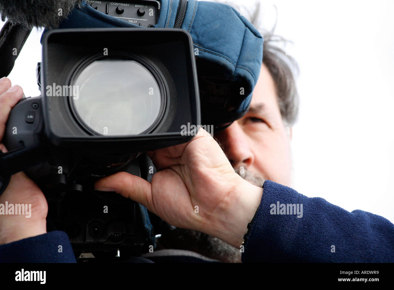 Professional camera man filming scenes Stock Photo - Alamy