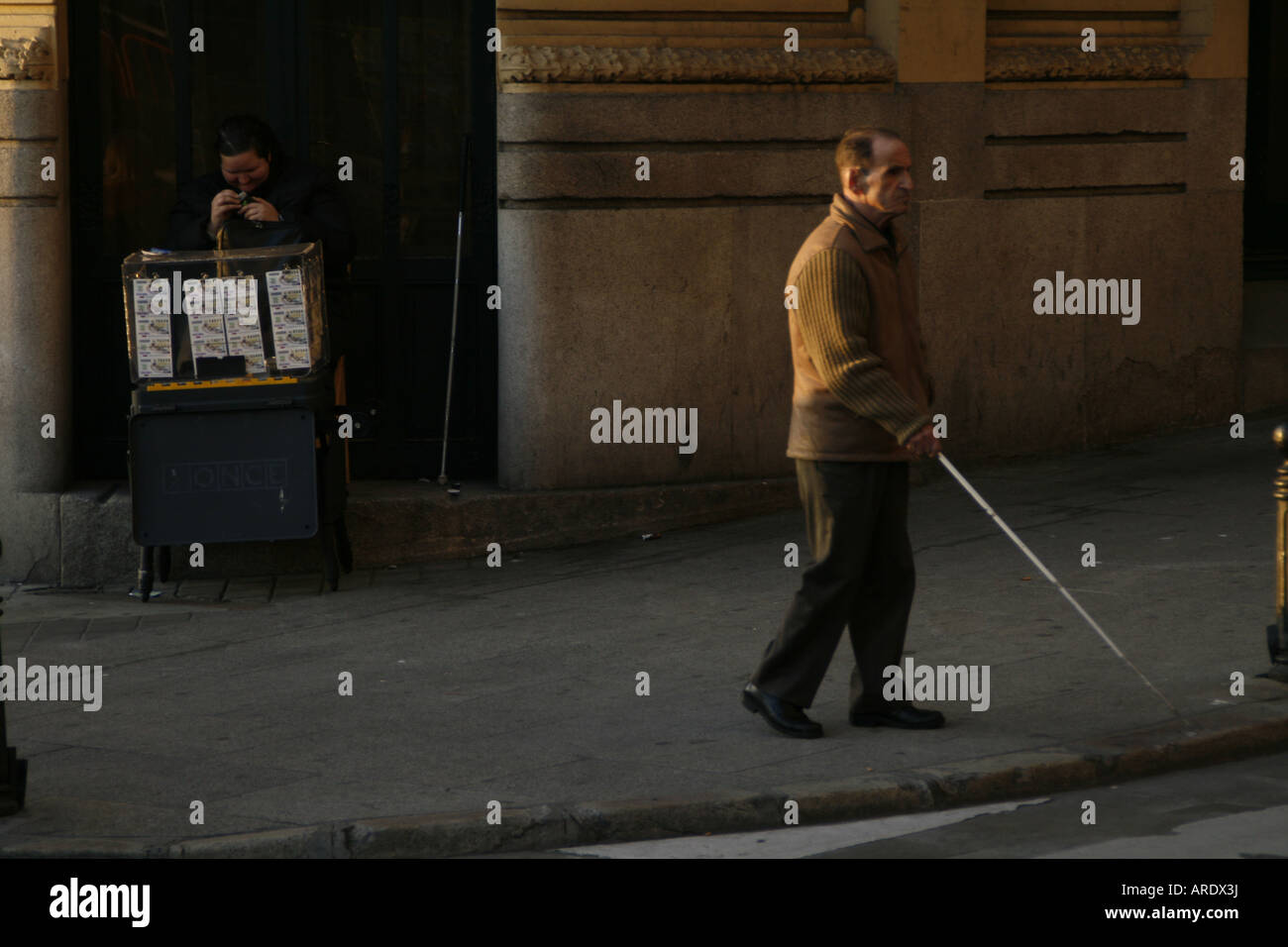 Blind man and lottery seller in La Coruña, Spain Stock Photo - Alamy