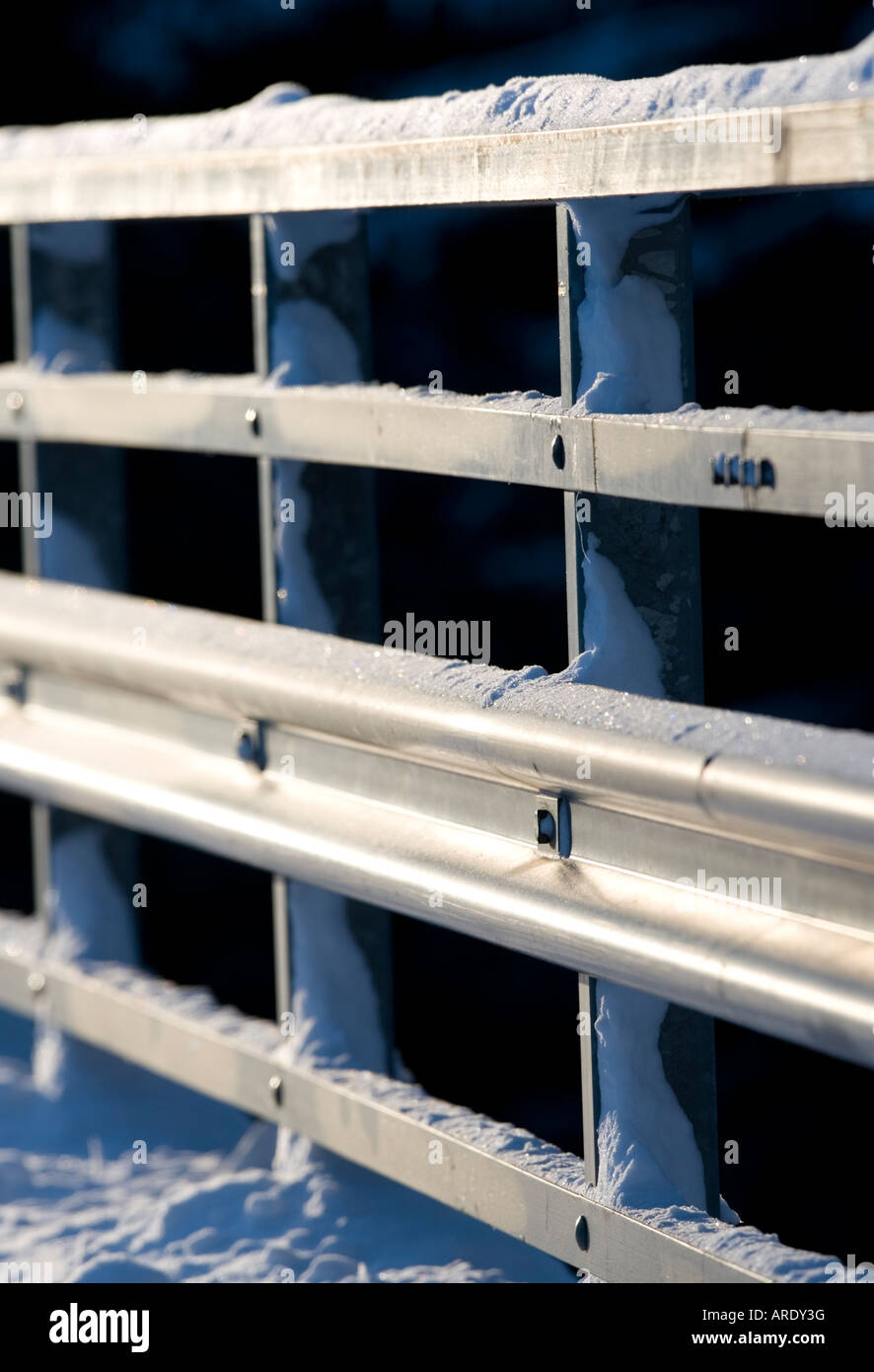 Closeup of a metallic snowy road bridge railing at Winter , Finland ...