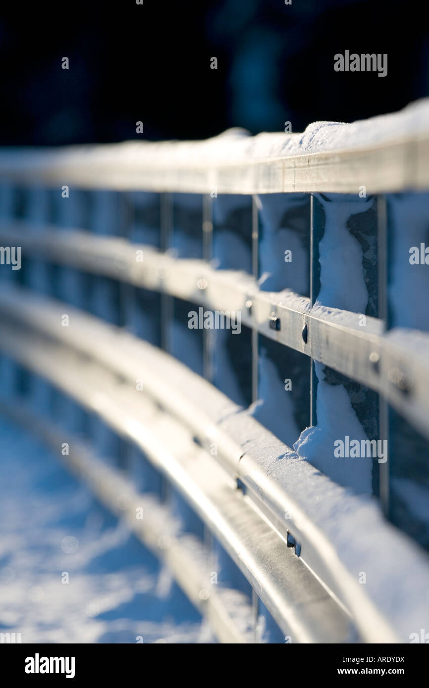 Closeup of a metallic snowy road bridge railing at Winter , Finland ...