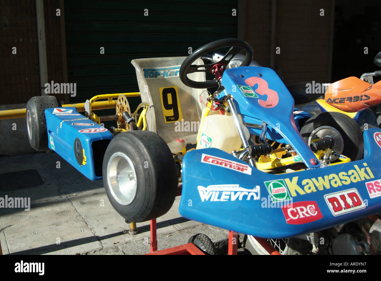 go kart racing car on its maintenance stand in the pits Stock Photo - Alamy