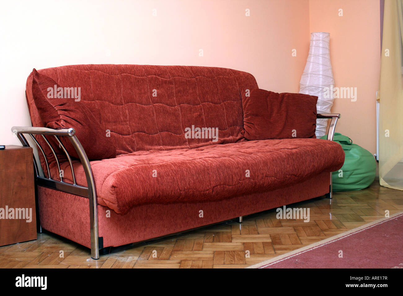 Red comfortable couch Stock Photo - Alamy
