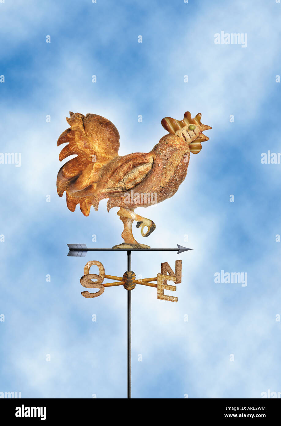 weathercock made of a variety of french regional breads on blue sky ...