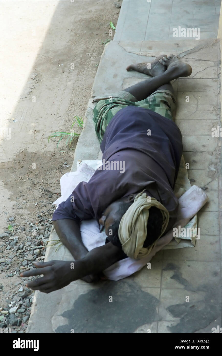 Homeless man sleeping in the street India Kerala a state on the ...