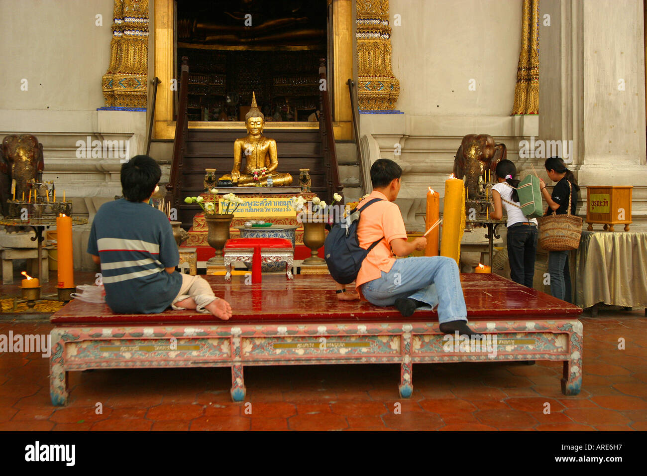 men Praying inside a Buddhist temple Thailand Bangkok Stock Photo - Alamy