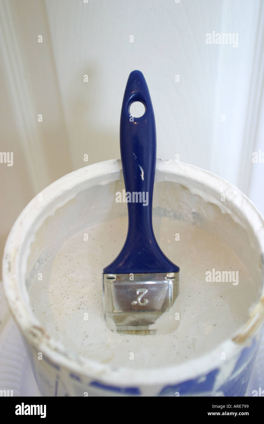 Paint tin and brush Stock Photo - Alamy