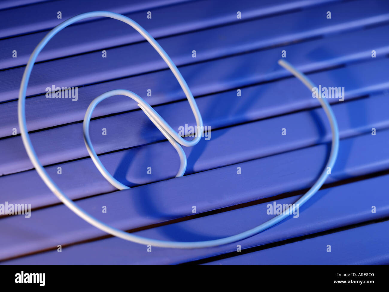 blue"at" sign on blue duckboard Stock Photo - Alamy