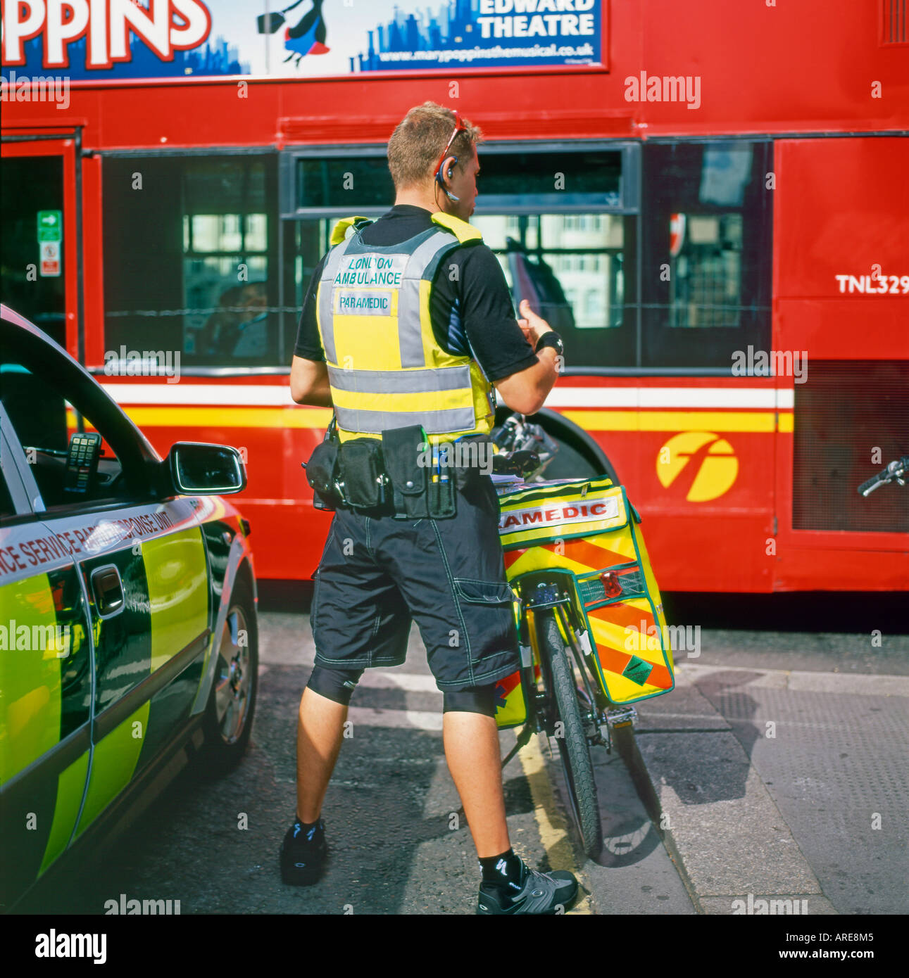 Paramedic from the London Ambulance Service on duty standing by his ...