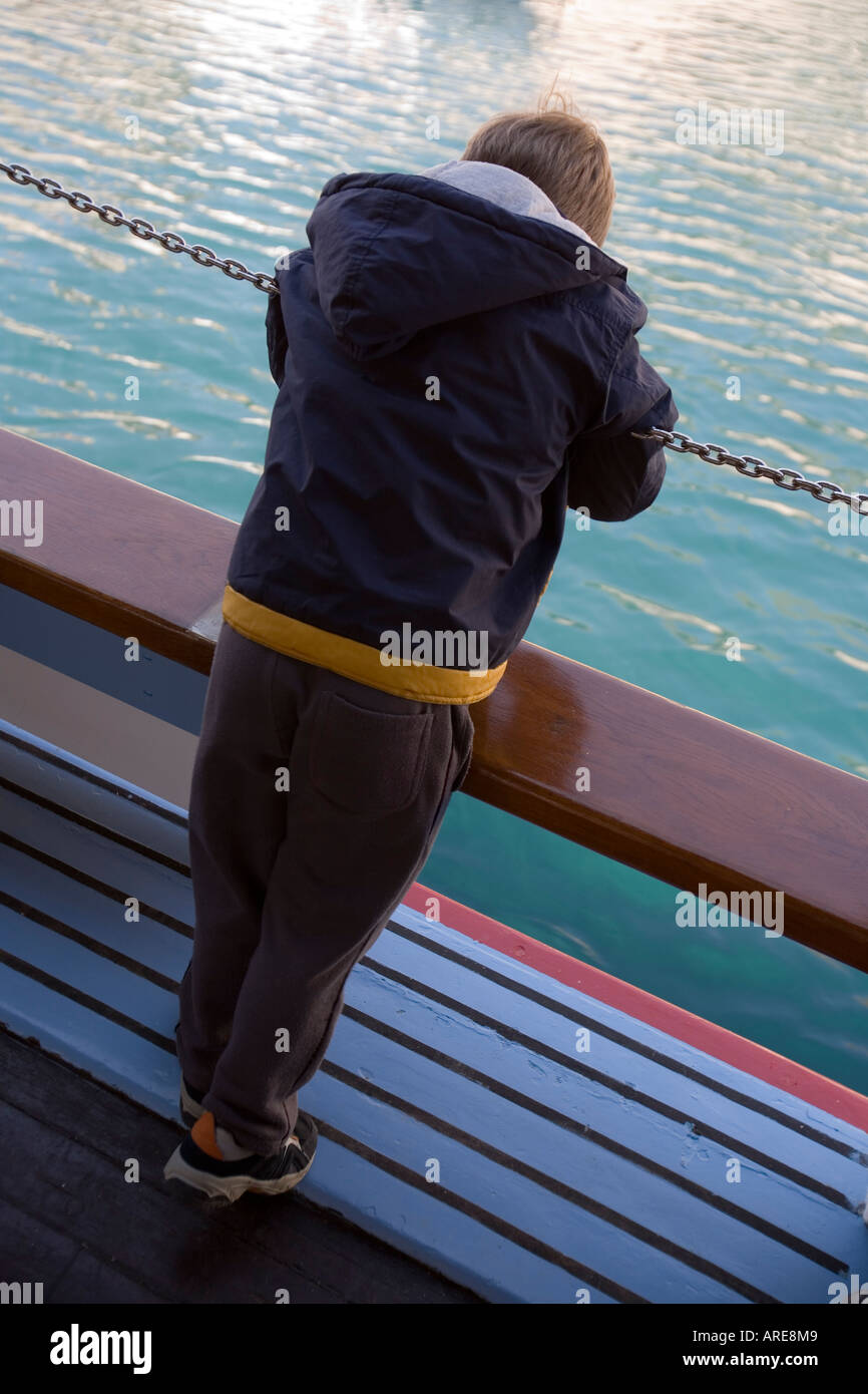 Boy Looking at the Ocean Stock Photo - Alamy