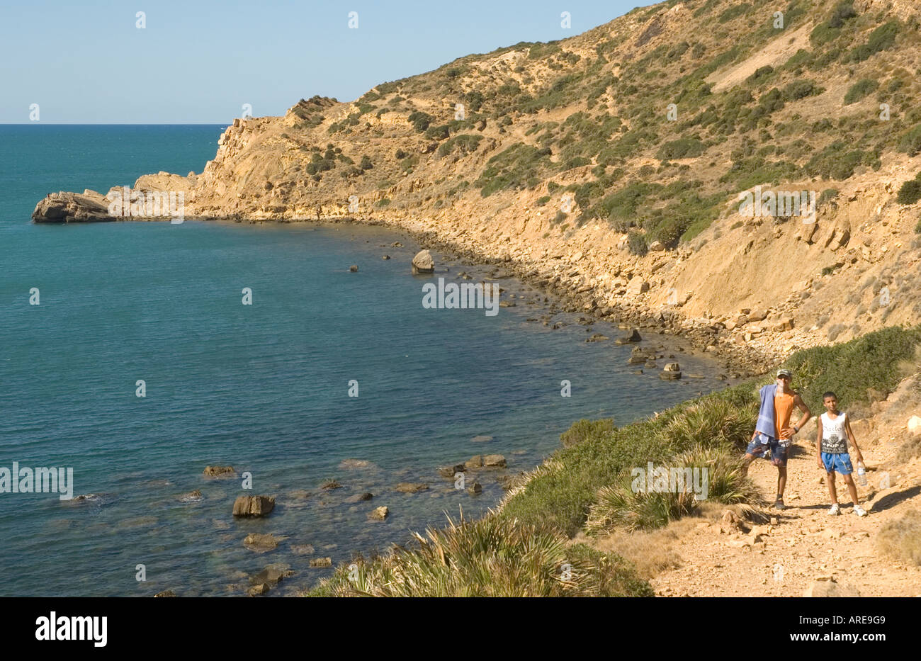 People walking on a tiny mountainous path at the Cap Bon peninsula, a ...