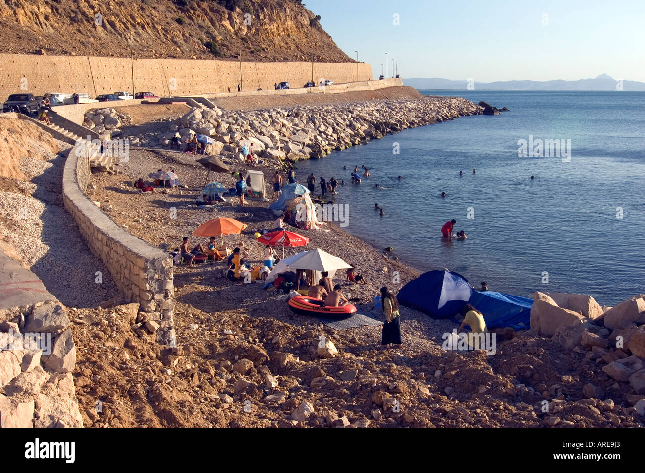 A crowded tiny beach near Korbous, Cap Bon peninsula, Tunisia Stock ...
