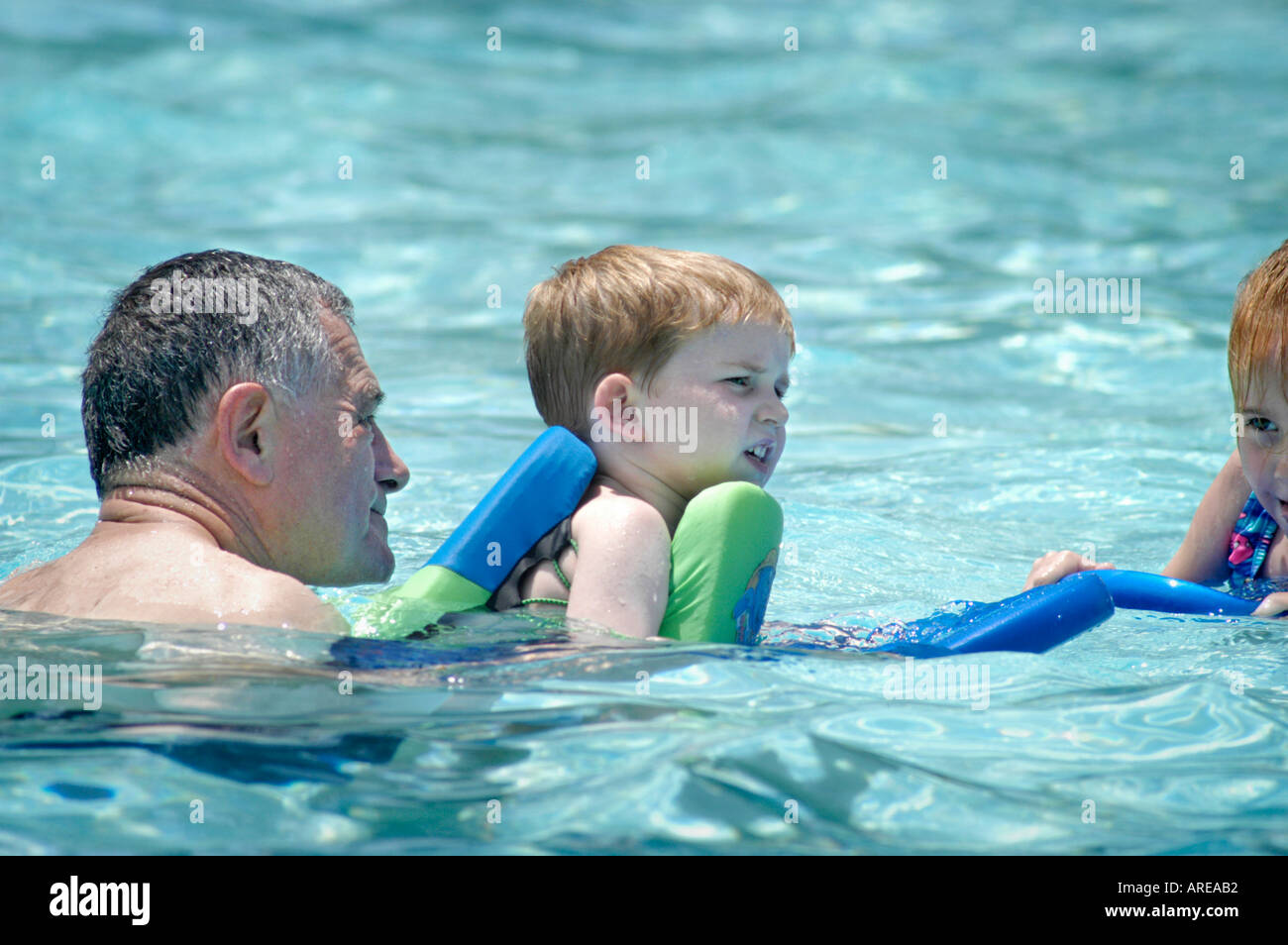 Teaching kids to swim hi-res stock photography and images - Alamy