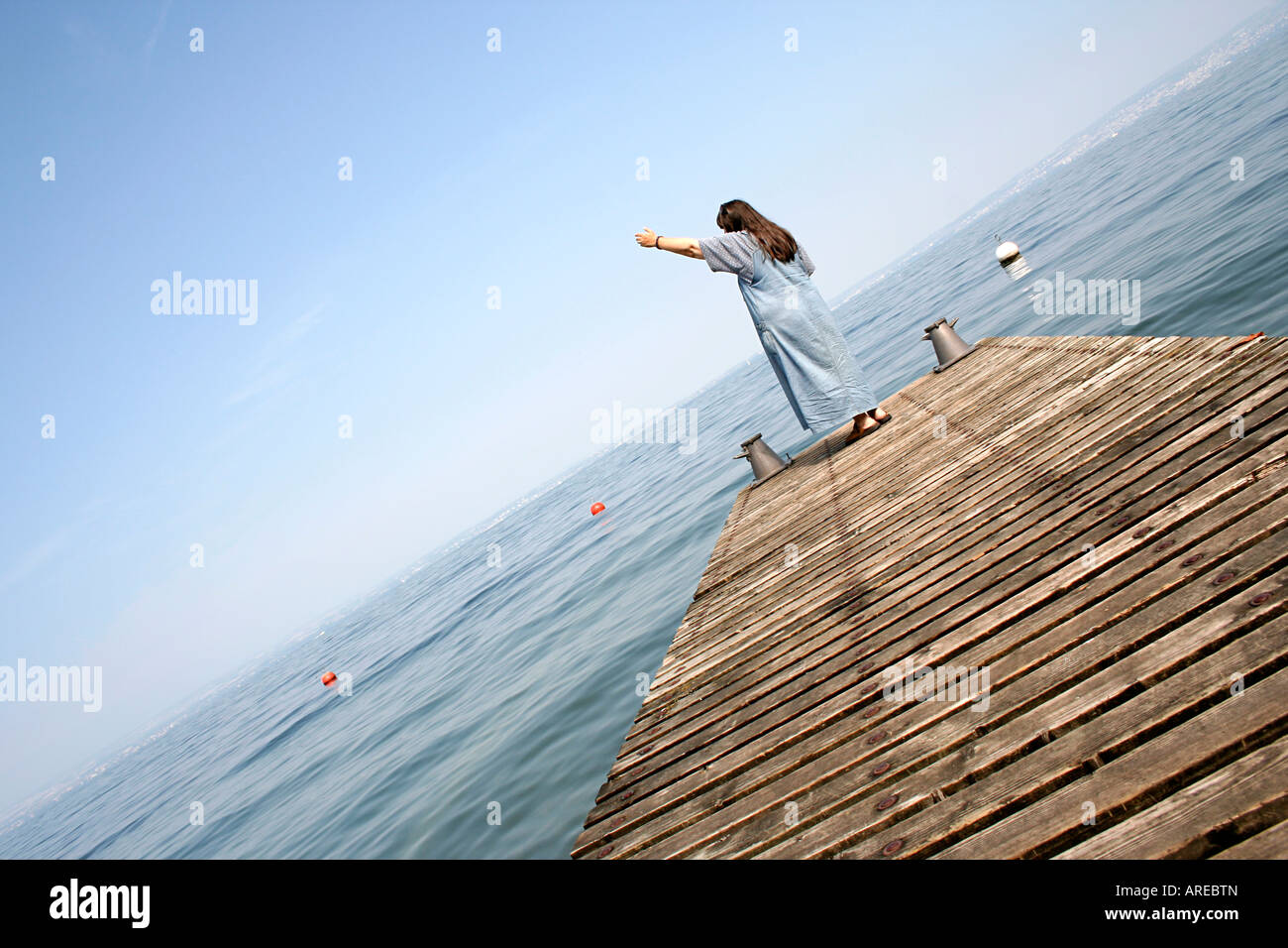 Old footbridge over blue ocean Stock Photo - Alamy
