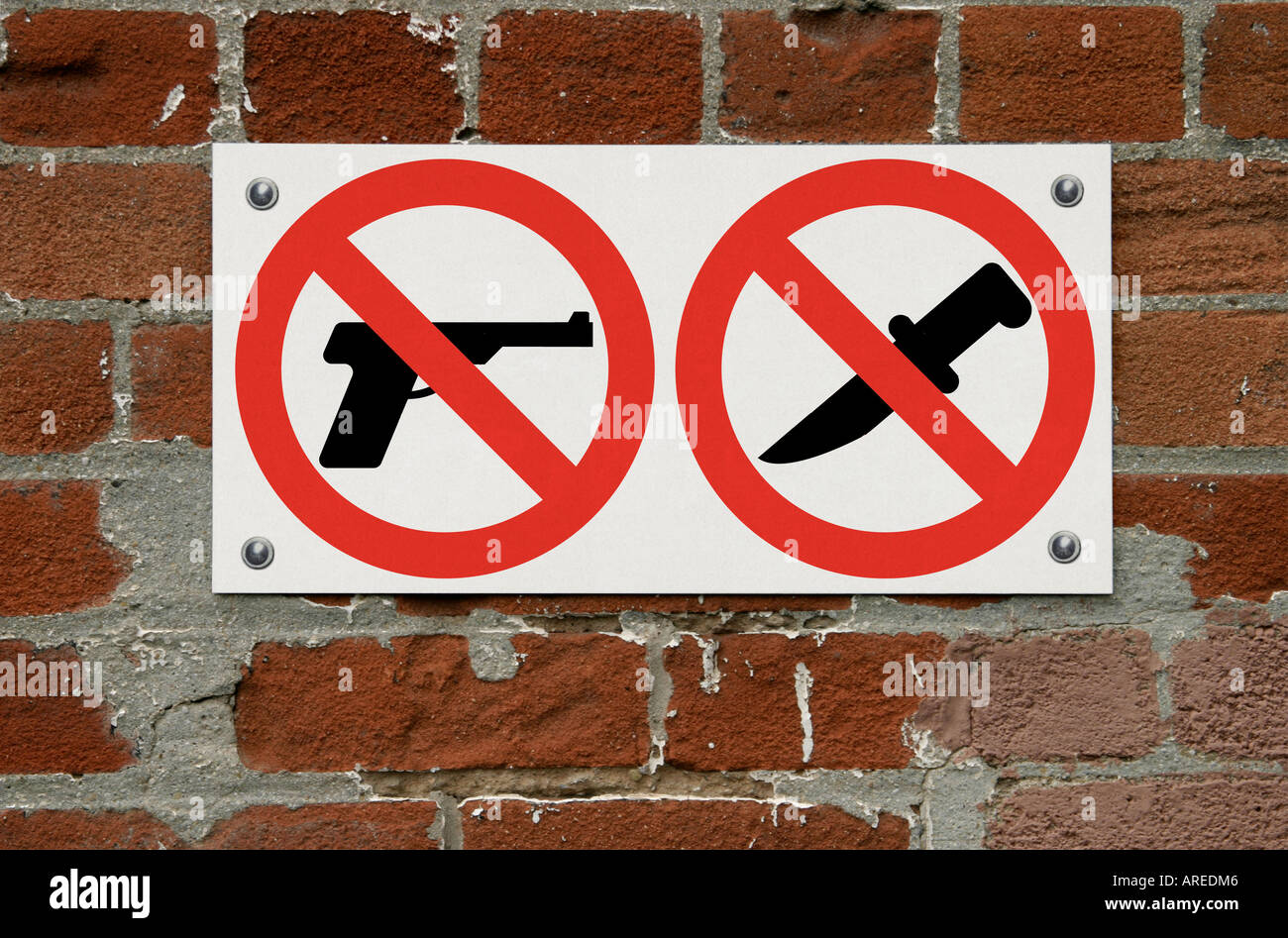 No firearms guns or knives allowed or weapons prohibited warning sign ...